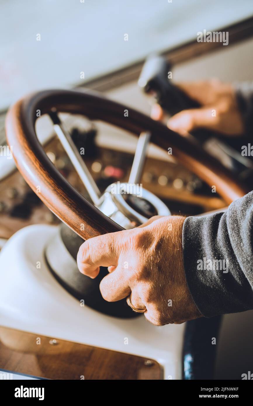 Hands captain steering wheel hi-res stock photography and images - Alamy