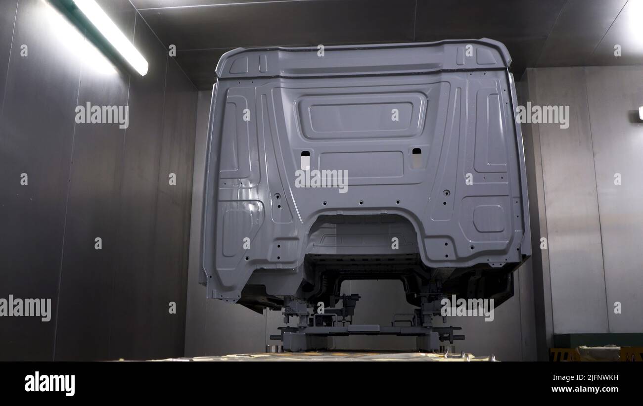 Metal frame of car body at factory. Scene. Modern automated equipment ...