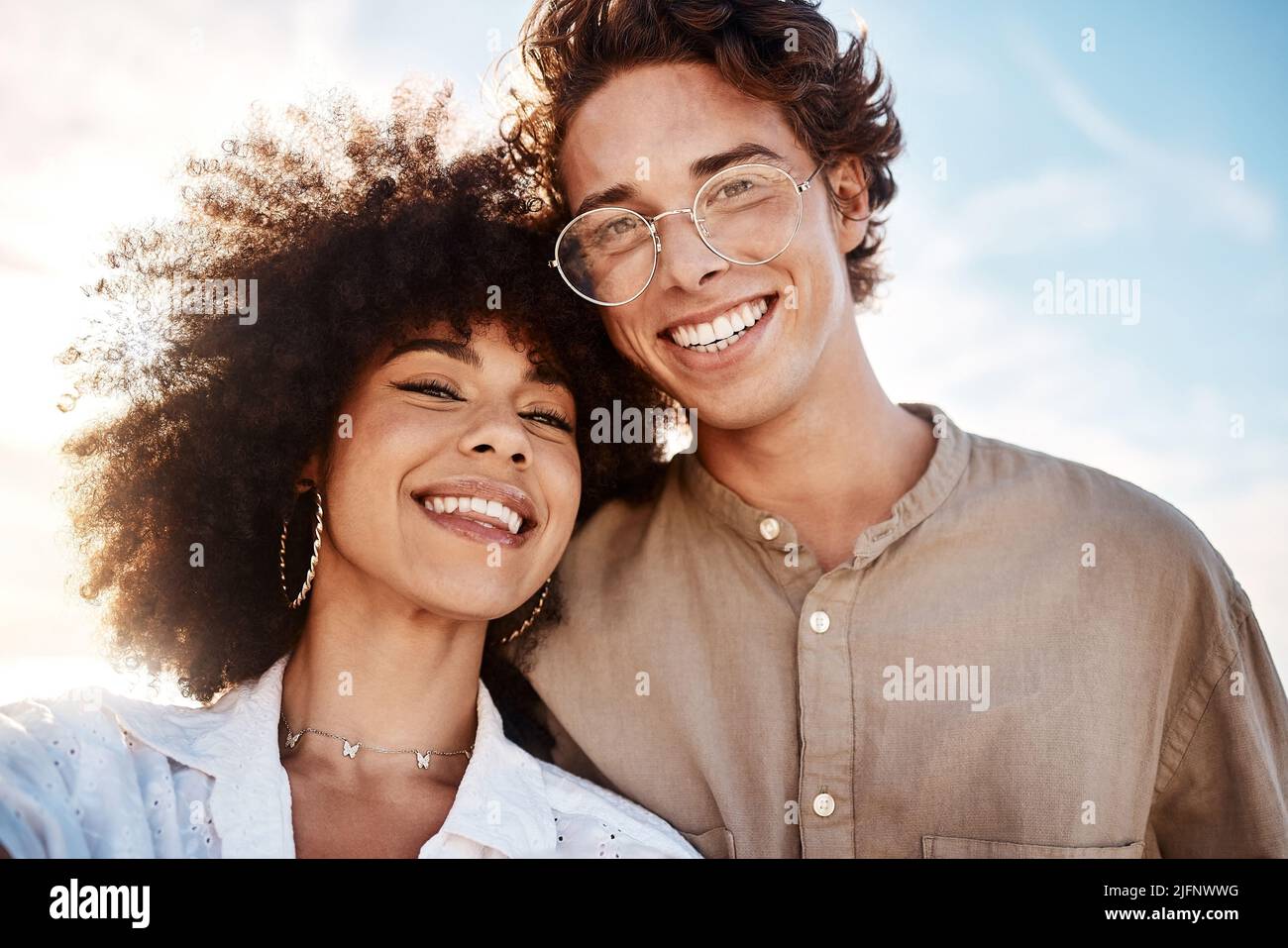 Portrait Of A Young Mixed Race Couple Enjoying A Day At The Beach