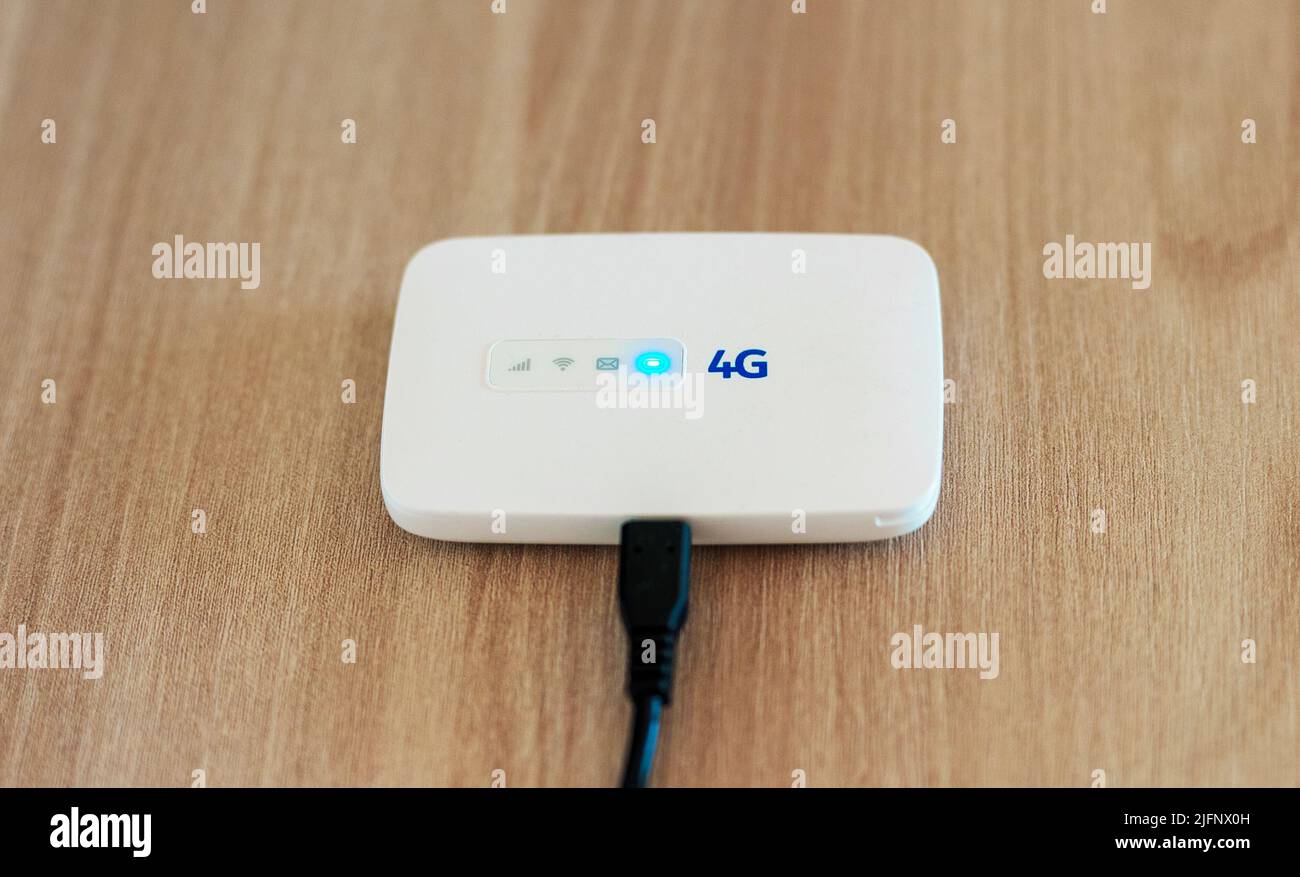 Modern wireless pocket 4g wifi modem Stock Photo - Alamy