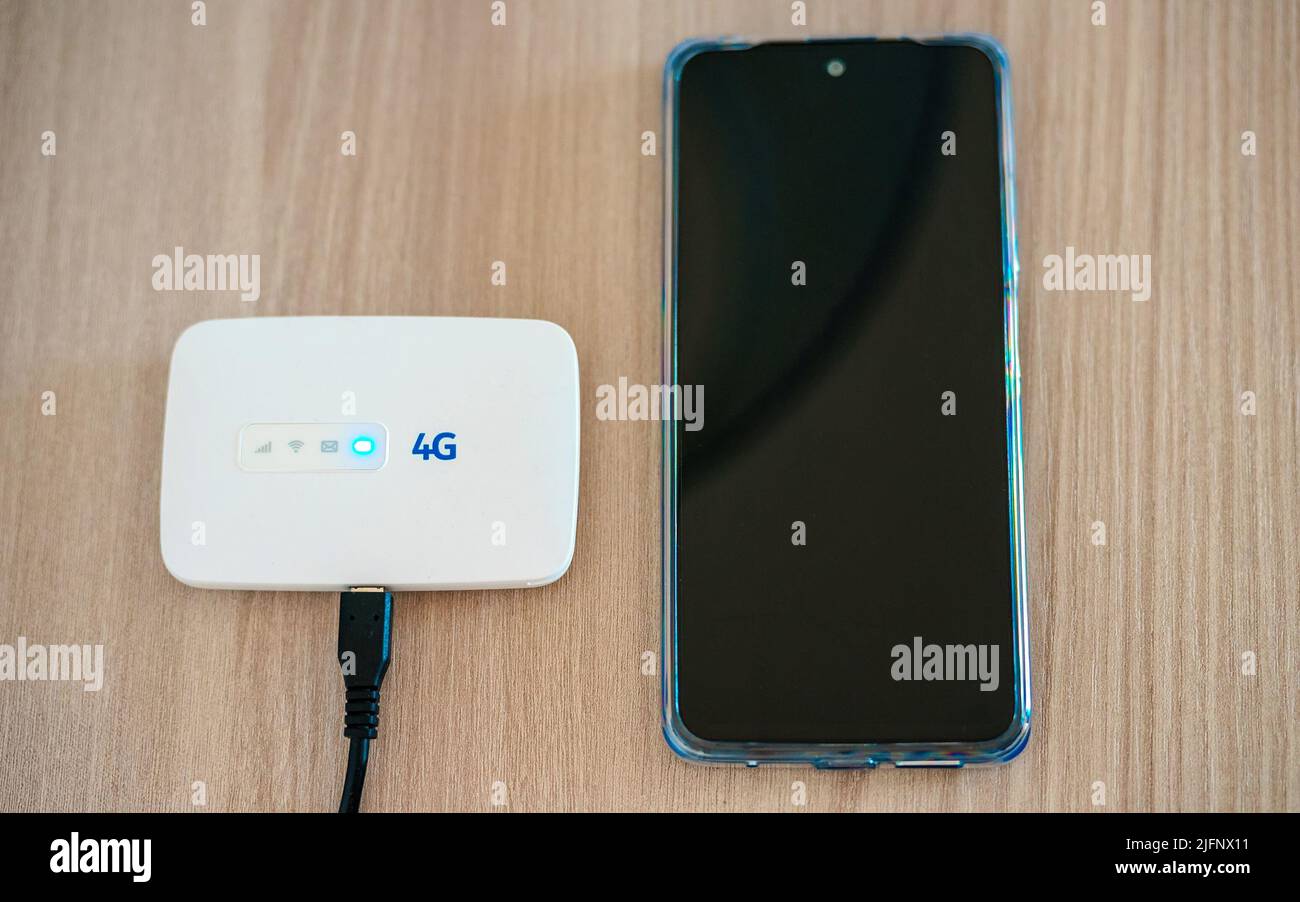 Modern wireless pocket 4g wifi modem Stock Photo - Alamy