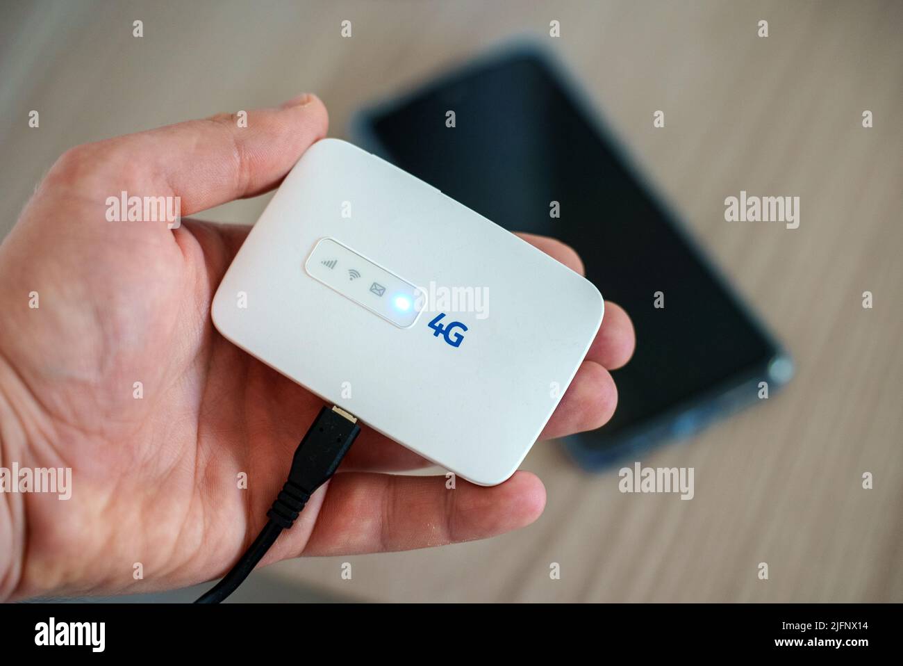 Modern wireless pocket 4g wifi modem Stock Photo - Alamy
