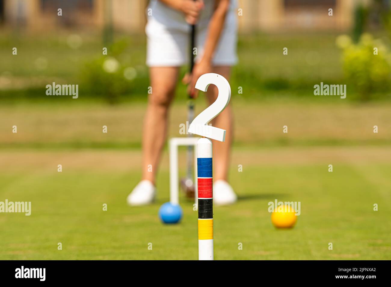 A person playing cricket in a field Stock Photo - Alamy