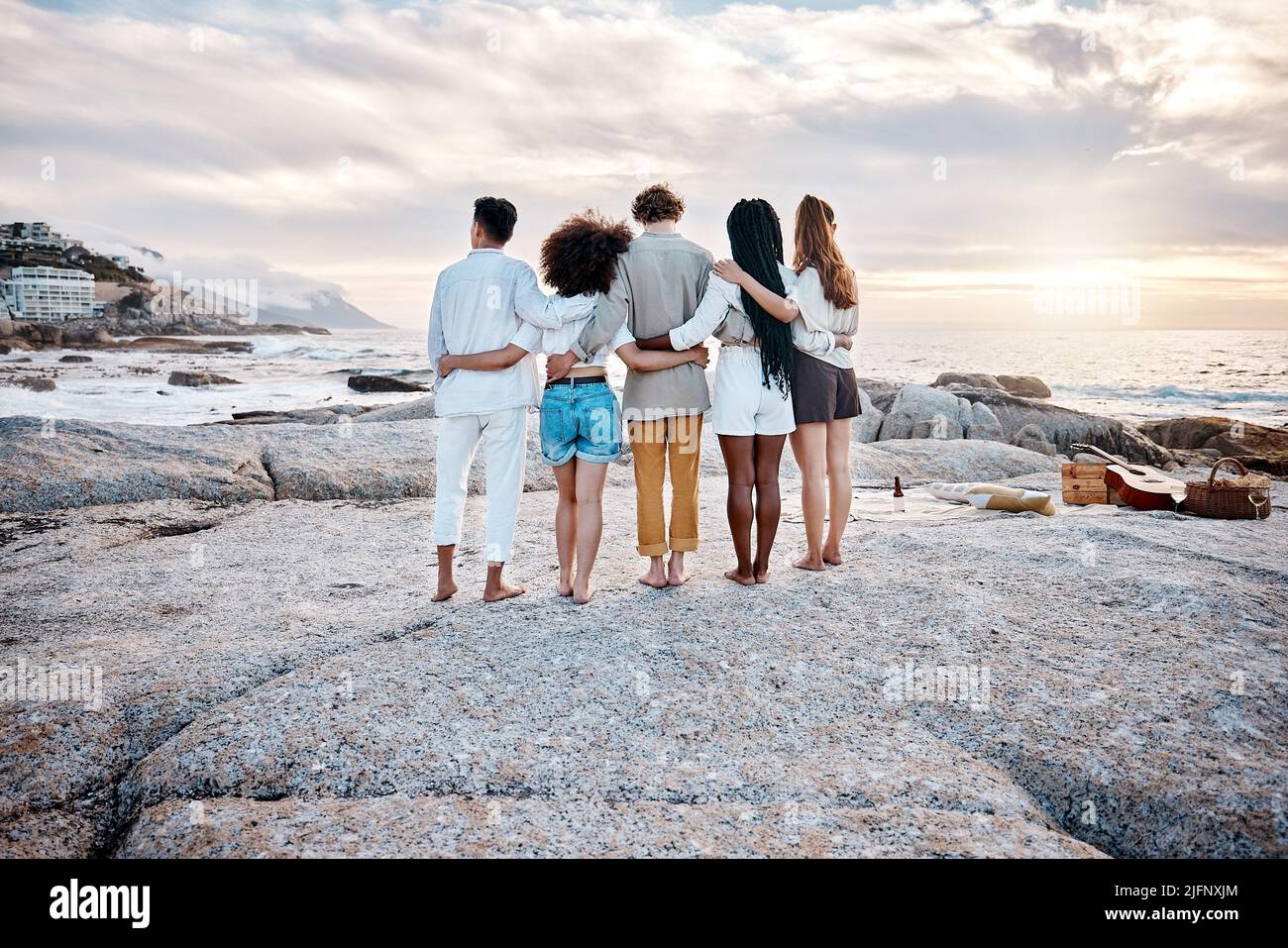 Rear view of a Unknown group of friends enjoying their time together at ...