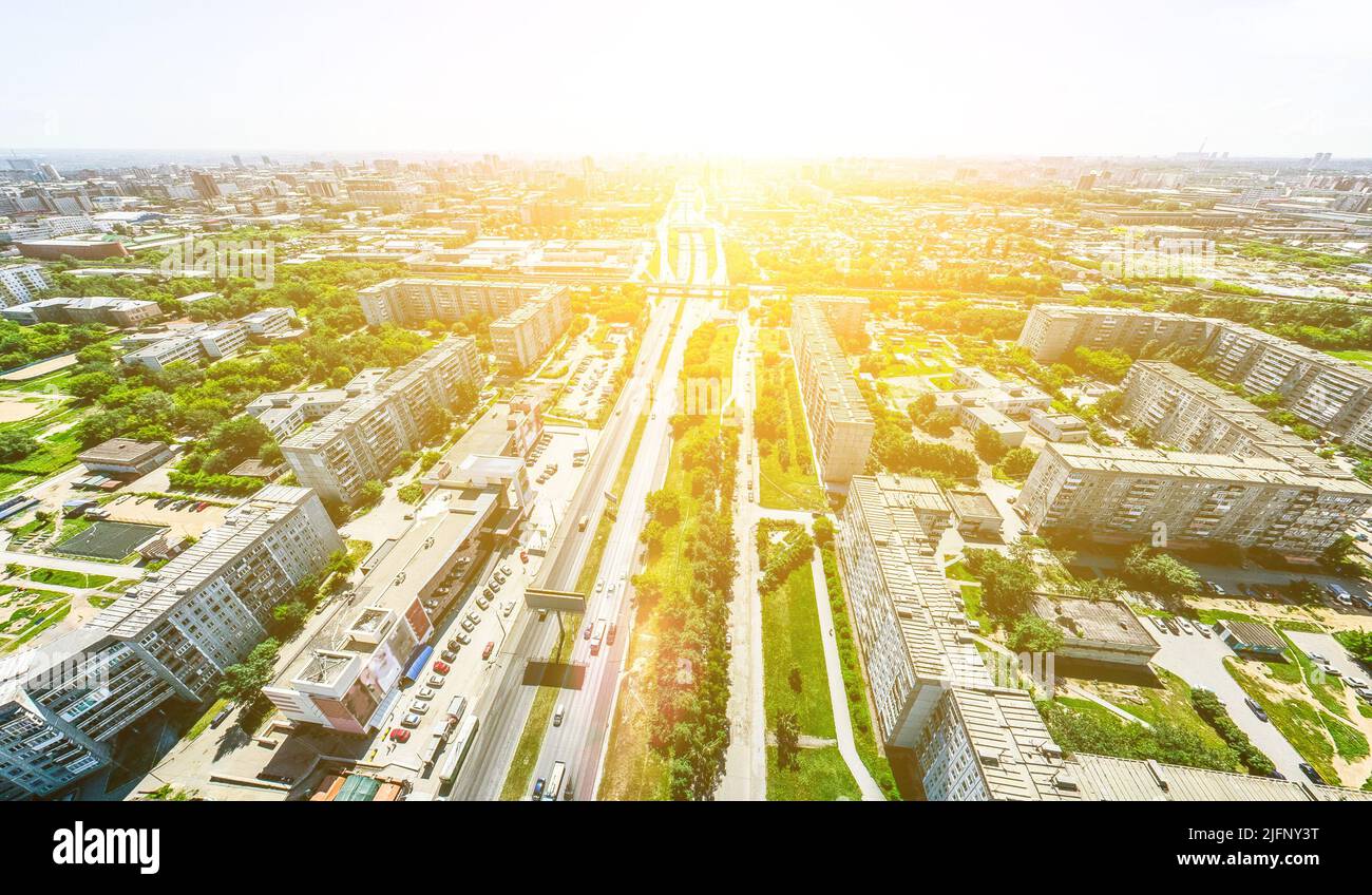 Aerial city view with crossroads and roads, houses, buildings, parks ...