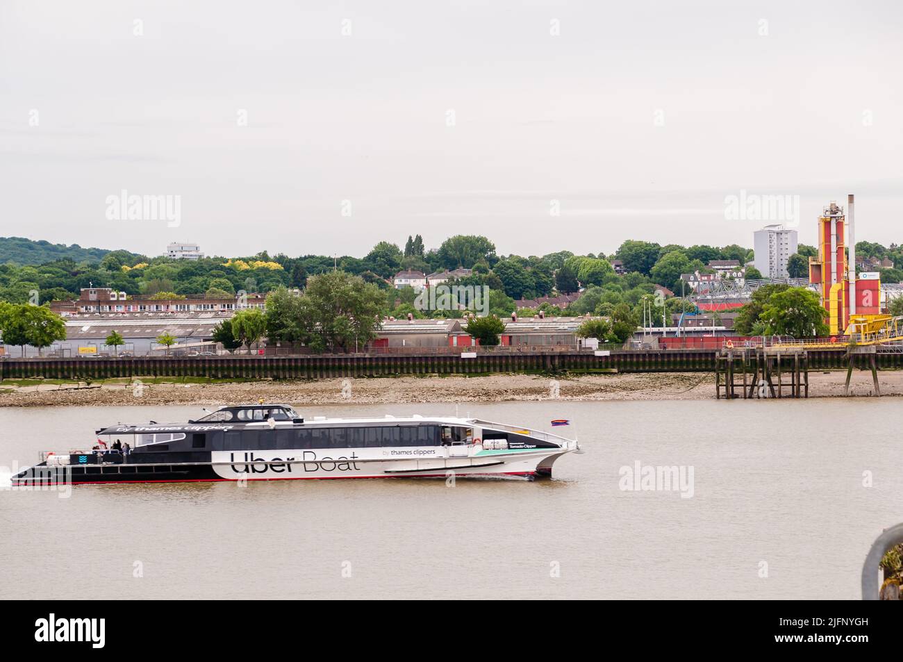 Royal Wharf Pier river boat entrance on the River Thames on a cloudy ...