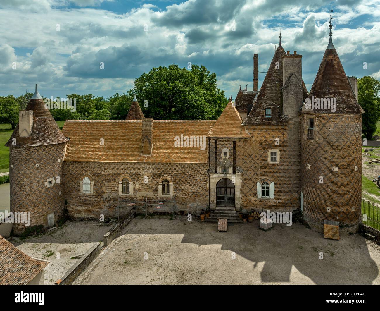 Aerial view of Chateau de la Cour-en-Chapeau in Allier France ...