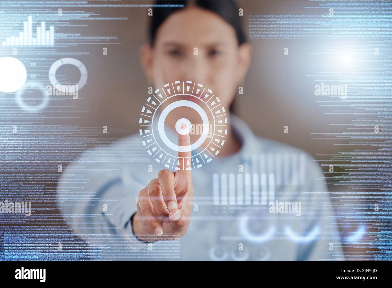 Young mixed race businesswoman using her finger to press on a 3d cgi ...
