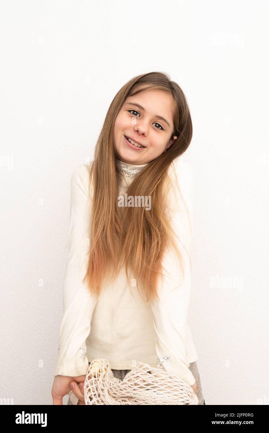 A cute beautiful girl shrugs her shoulders, expressing duality, the ...