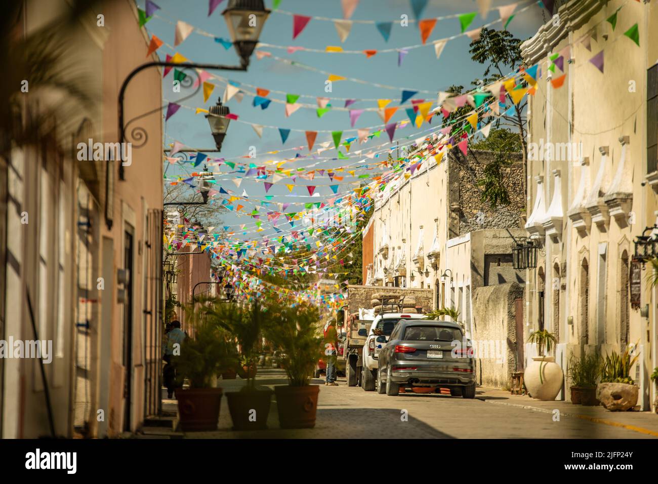 A street decorated with colorful flags to celebrate the Feast of Saint ...