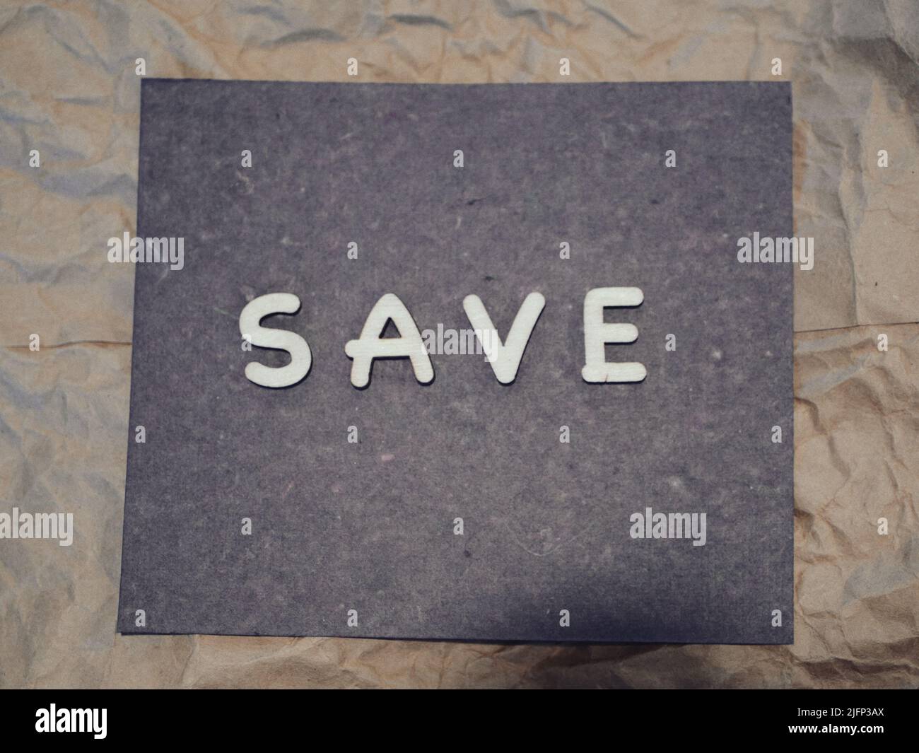 Save in wooden lettering. Perfect graphic to illustrate saving in a ...