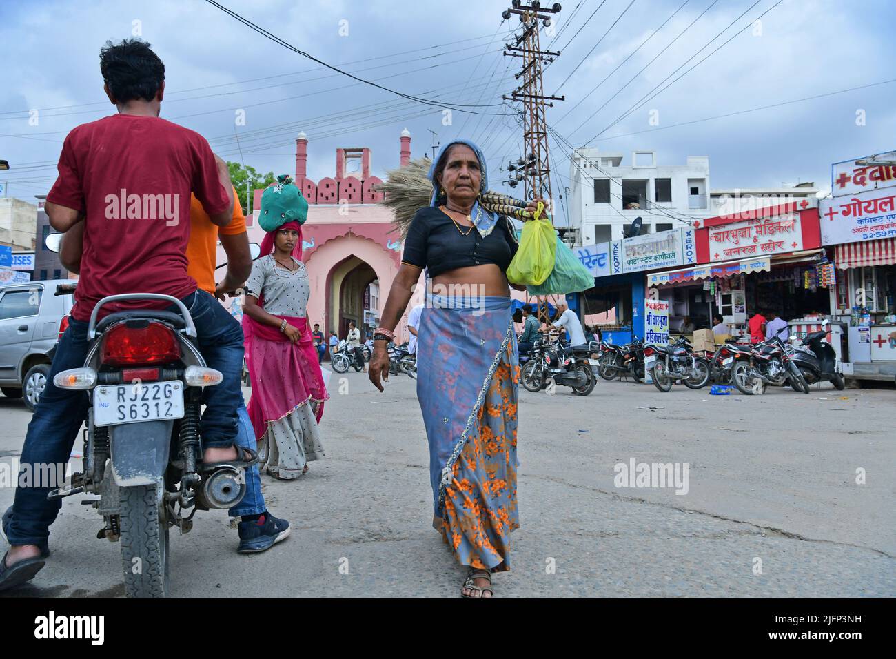 Beawar, Rajasthan, India. 4th July, 2022. Rural women walks in a market ...