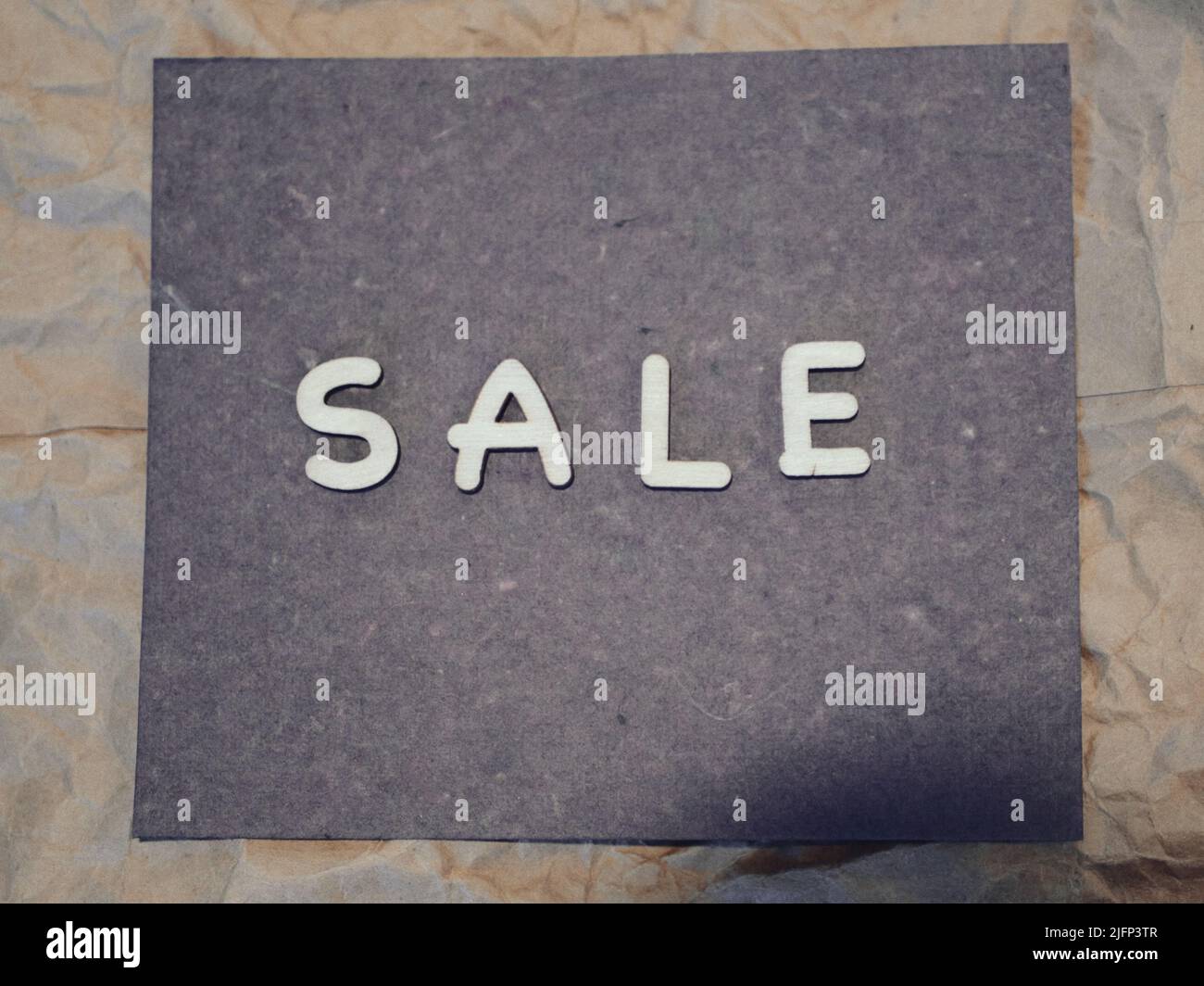 Sale in wooden lettering. Perfect graphic to illustrate a sale or ...