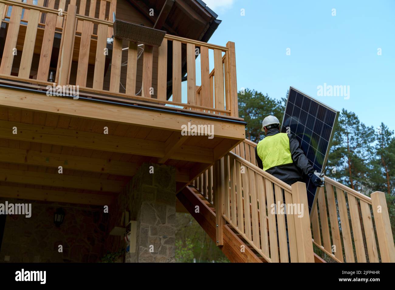 Man worker carrying solar panel for installing solar modul system on ...