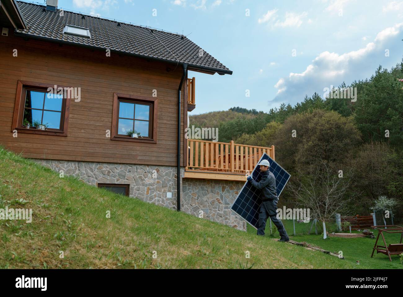 Man worker carrying solar panel for installing solar modul system on ...