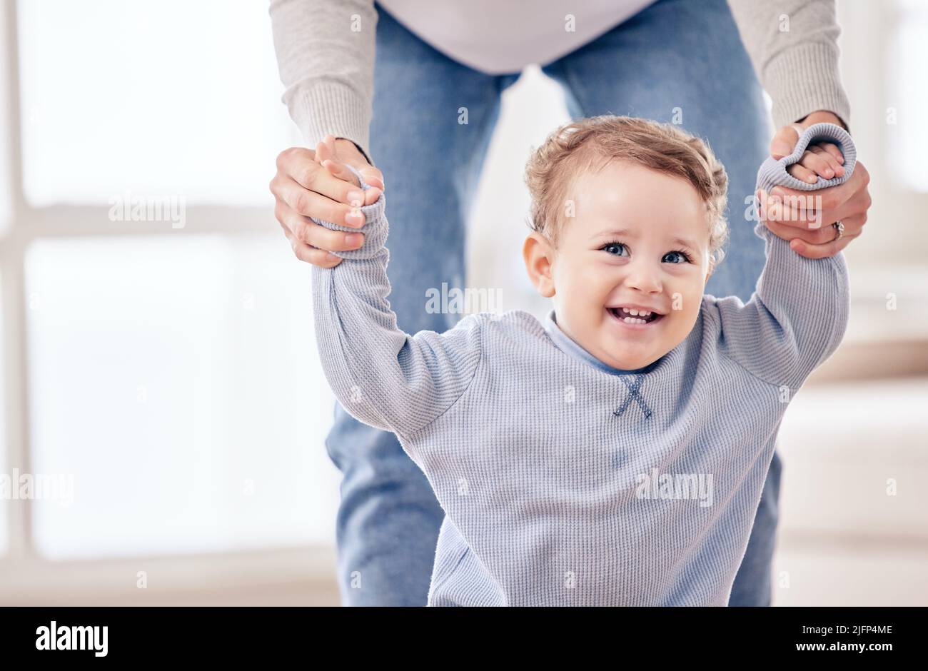 Walking sure is fun, I cant wait to do it on my own. Cropped shot of an ...