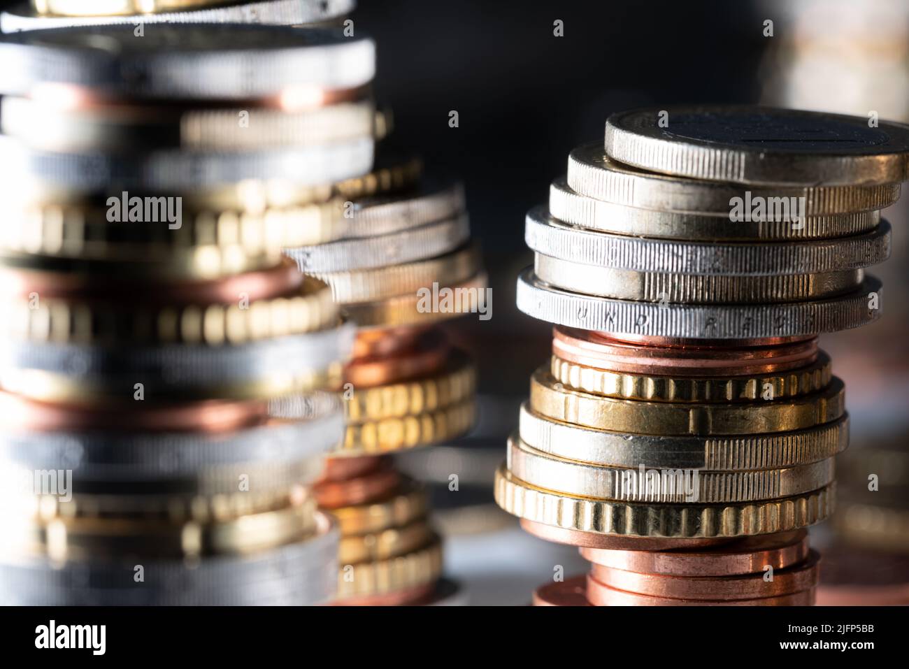 Stacked Euros out of focus and in focus. Closeup of European money ...