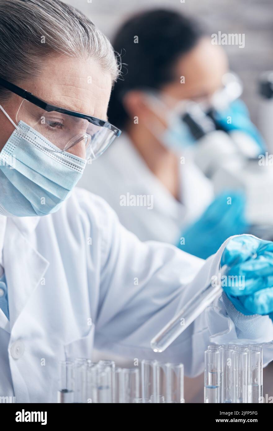 Making strides towards creating a beneficial cure. Shot of a mature ...