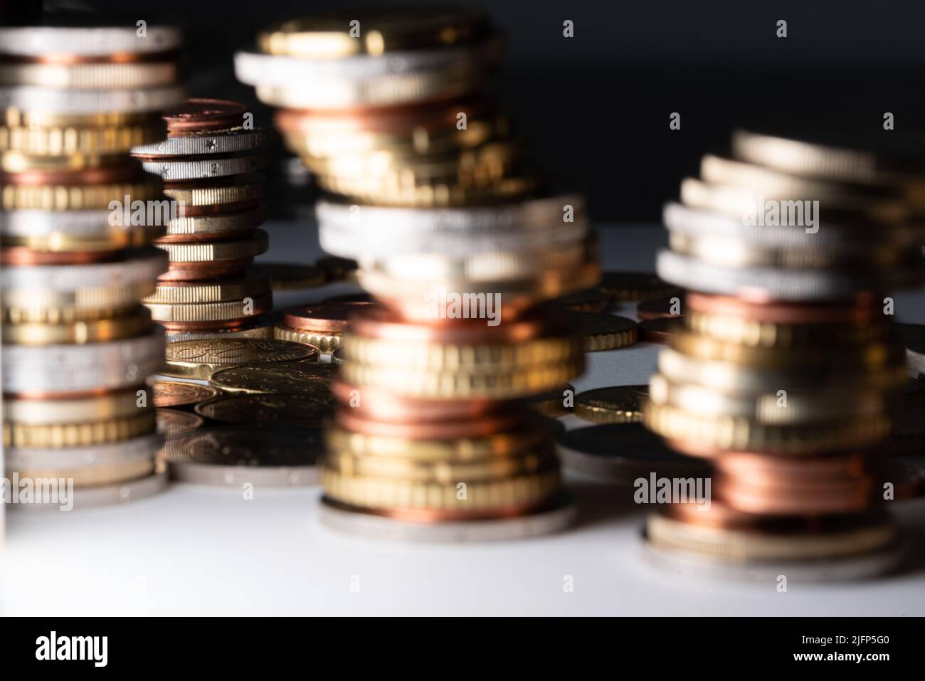 Stacked Euros leaning to the right. Euro coins in different sizes and ...