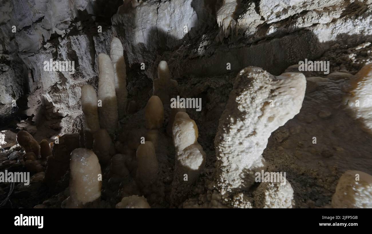 White cave stones.Tourist place. Action. A white stone cave that ...