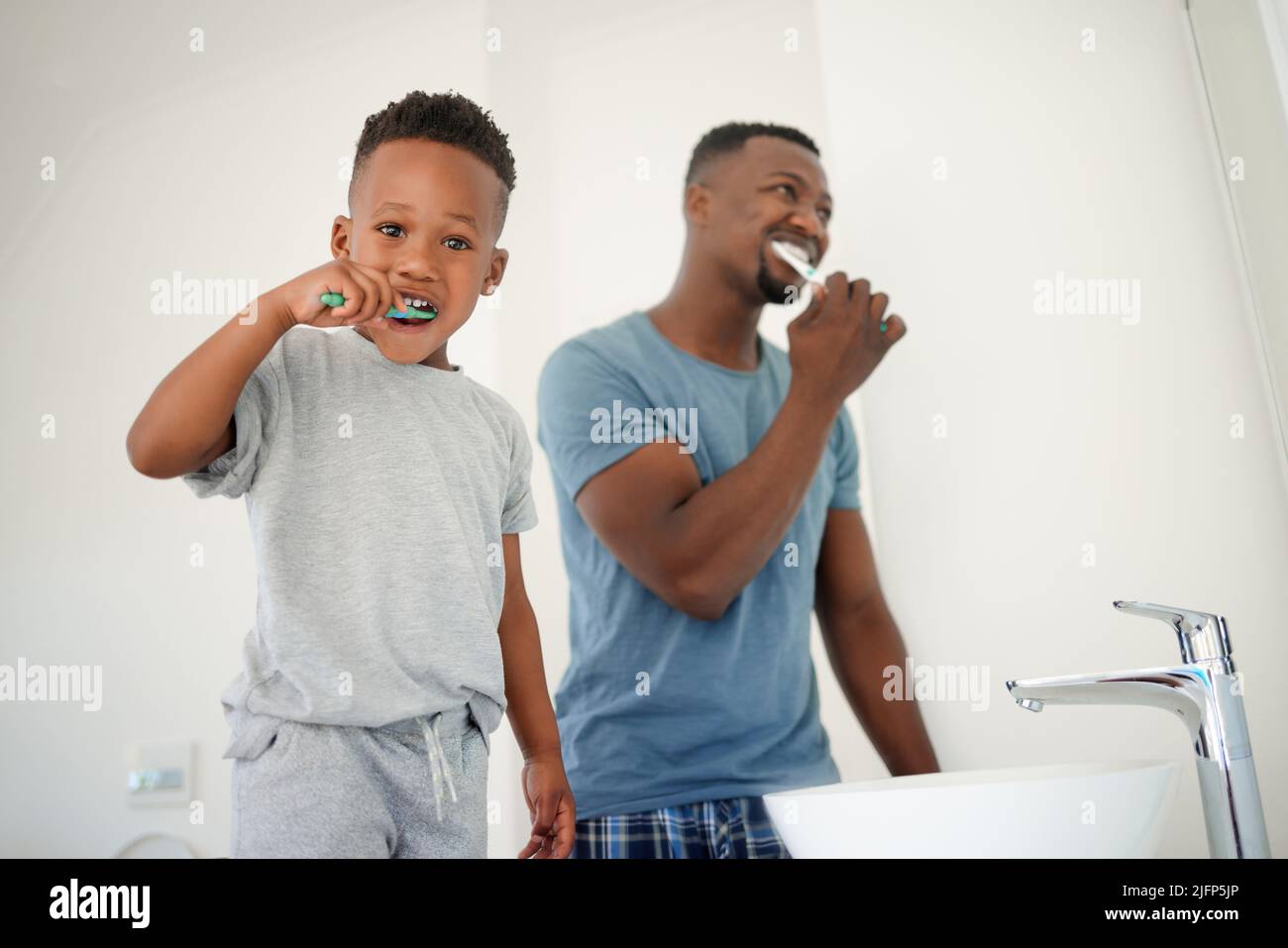 Dad showed me how to brush well. Portrait of a little boy brushing his ...