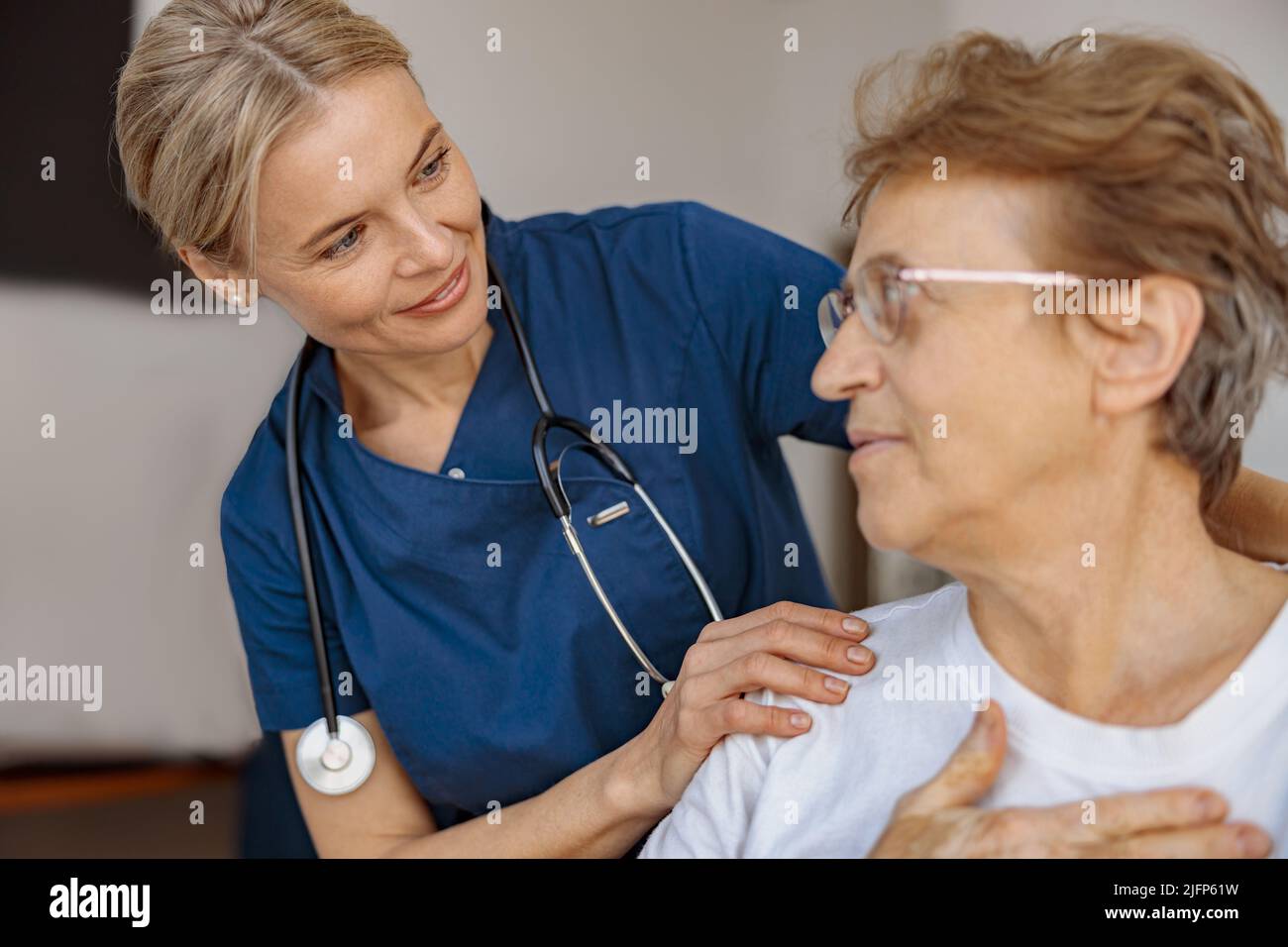 Doctor supporting a sick patient before medical procedures in a ...