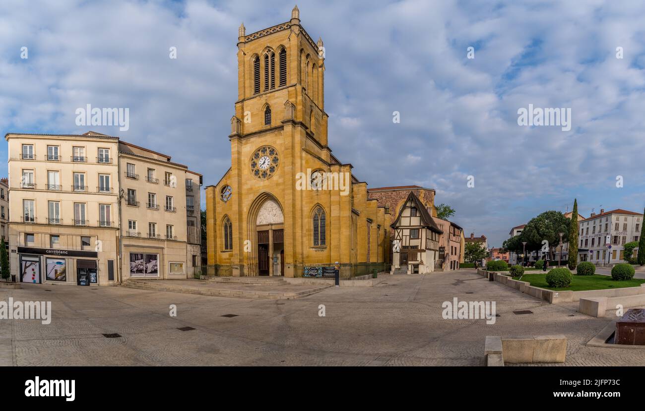 Aerial view of downtown Roanne in France with yellow church, old castle ...