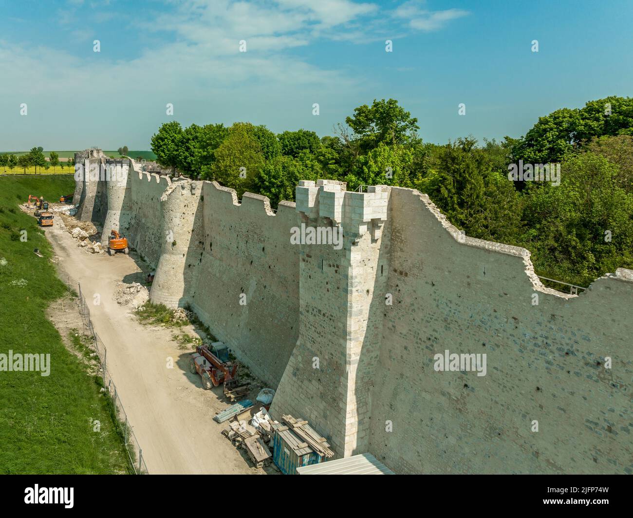Stone ramparts with towers, gate towers, moat in medieval Provins ...