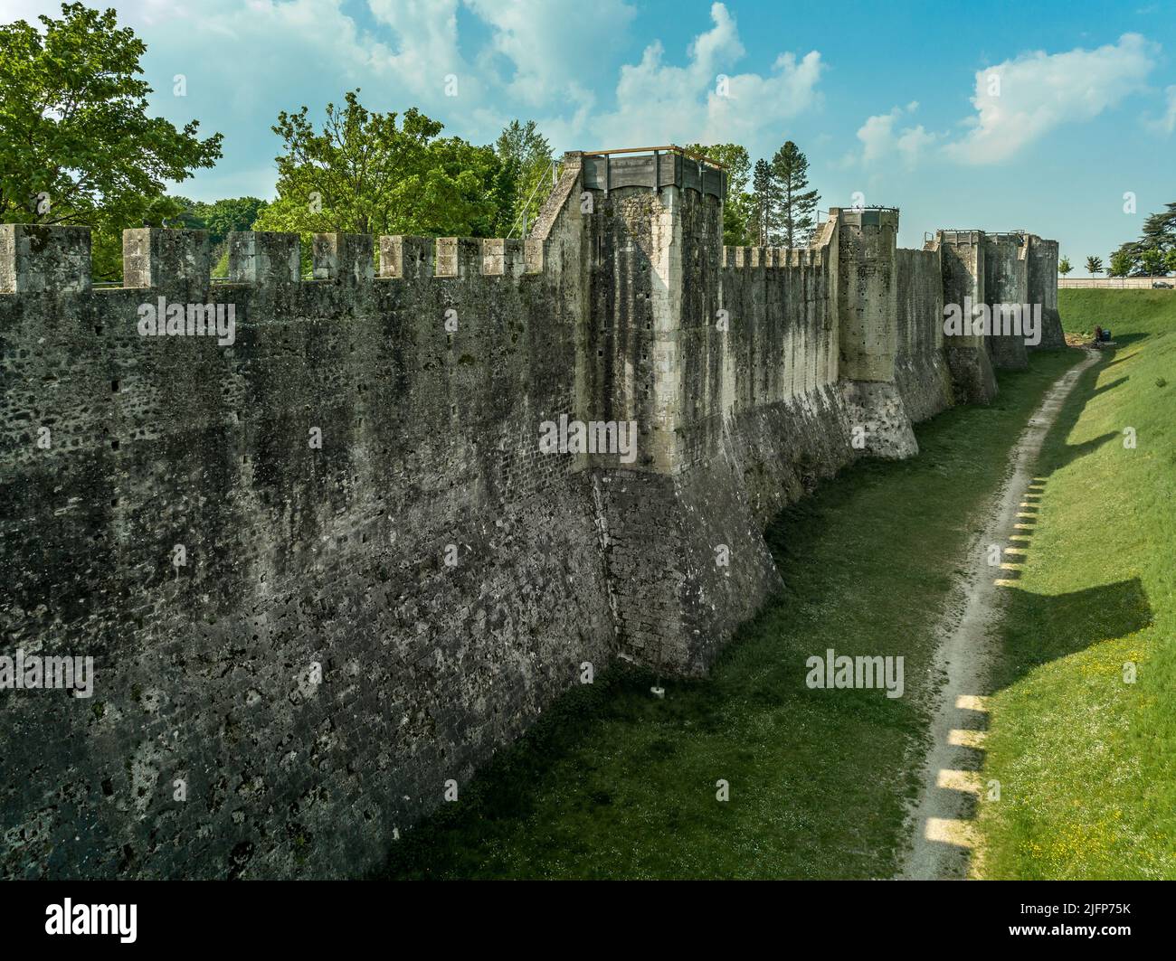 Stone ramparts with towers, gate towers, moat in medieval Provins ...