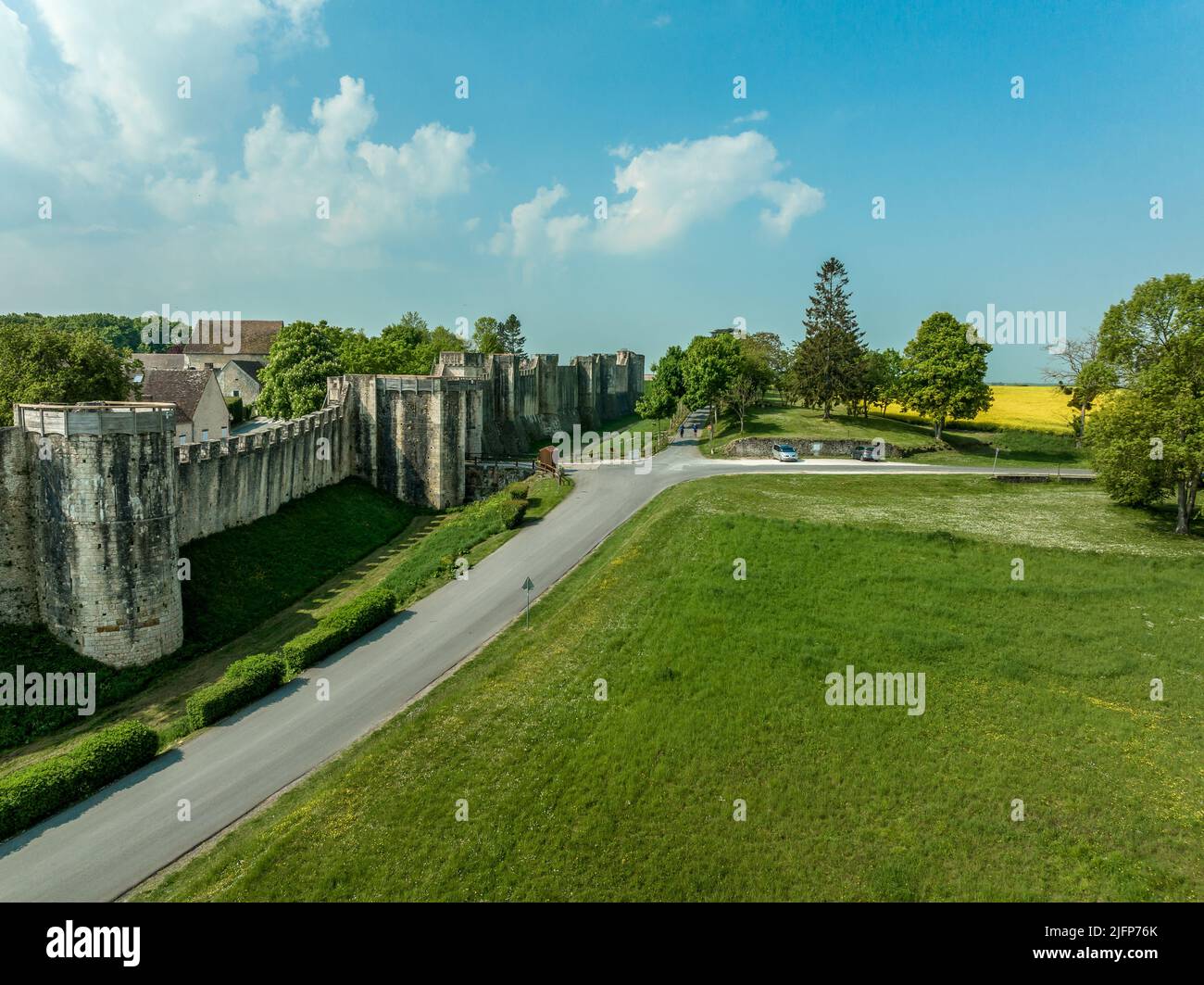 Stone ramparts with towers, gate towers, moat in medieval Provins ...