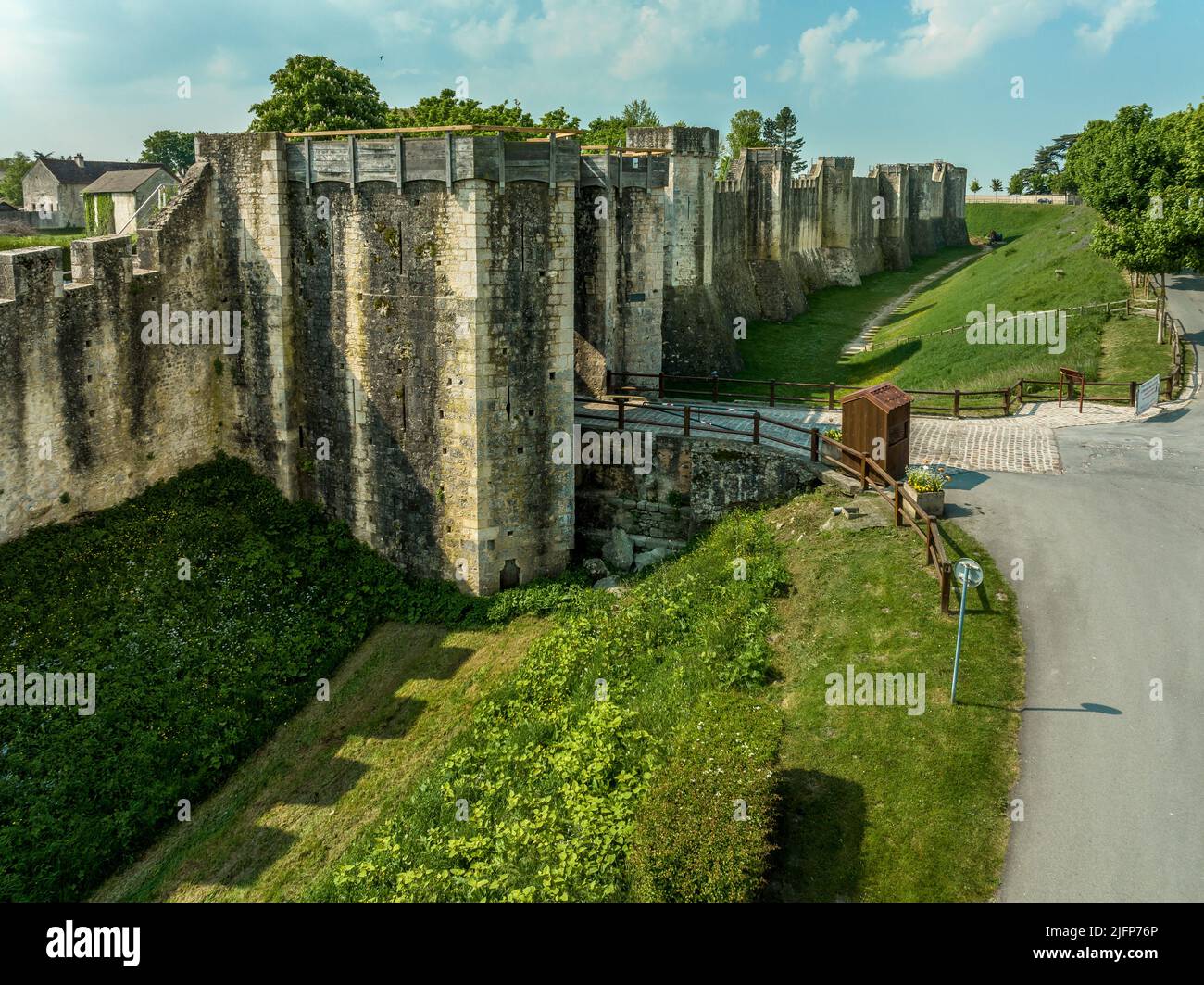 Stone ramparts with towers, gate towers, moat in medieval Provins ...