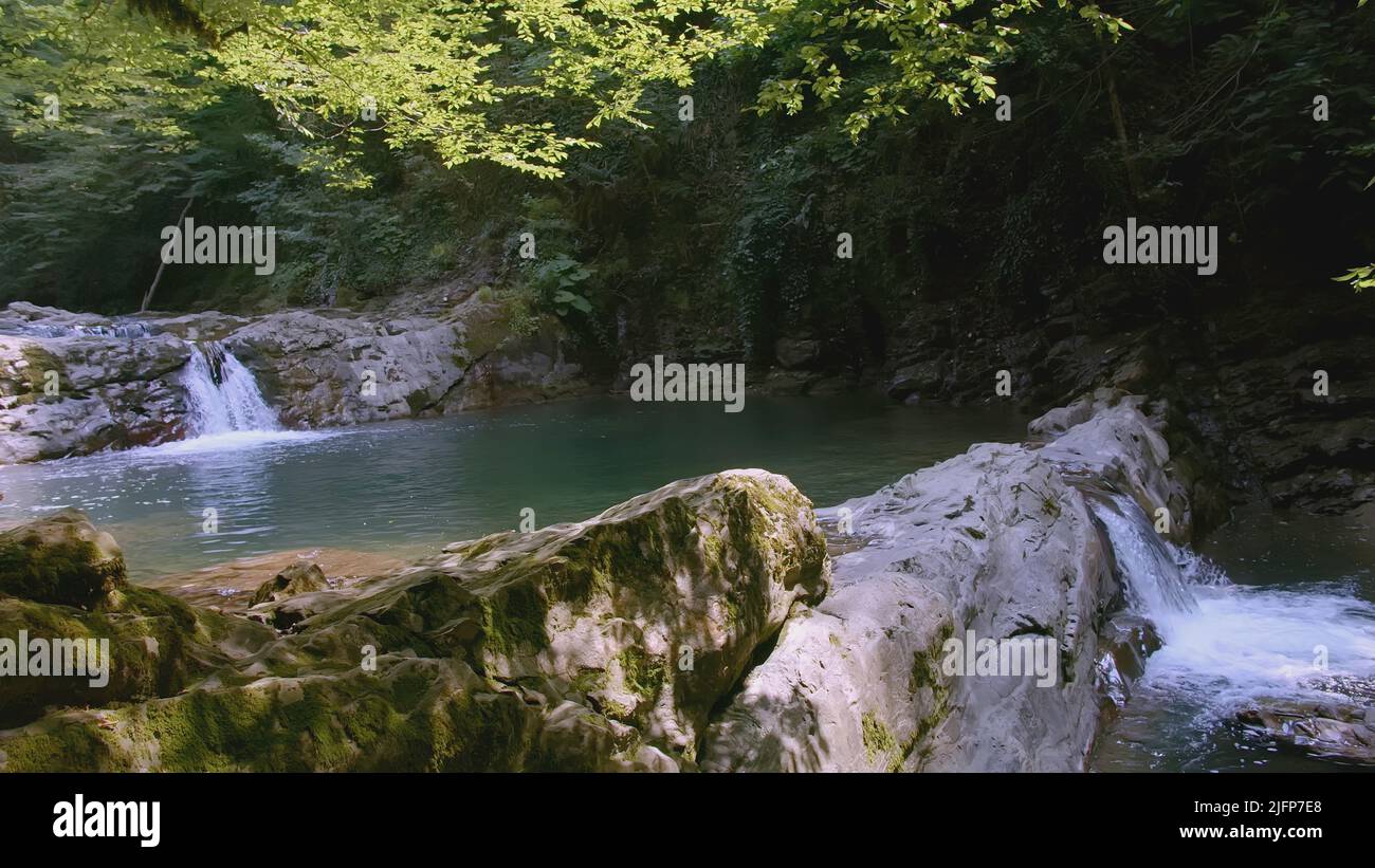 Beautiful little waterfalls with baths in forest. Creative. Top view of ...