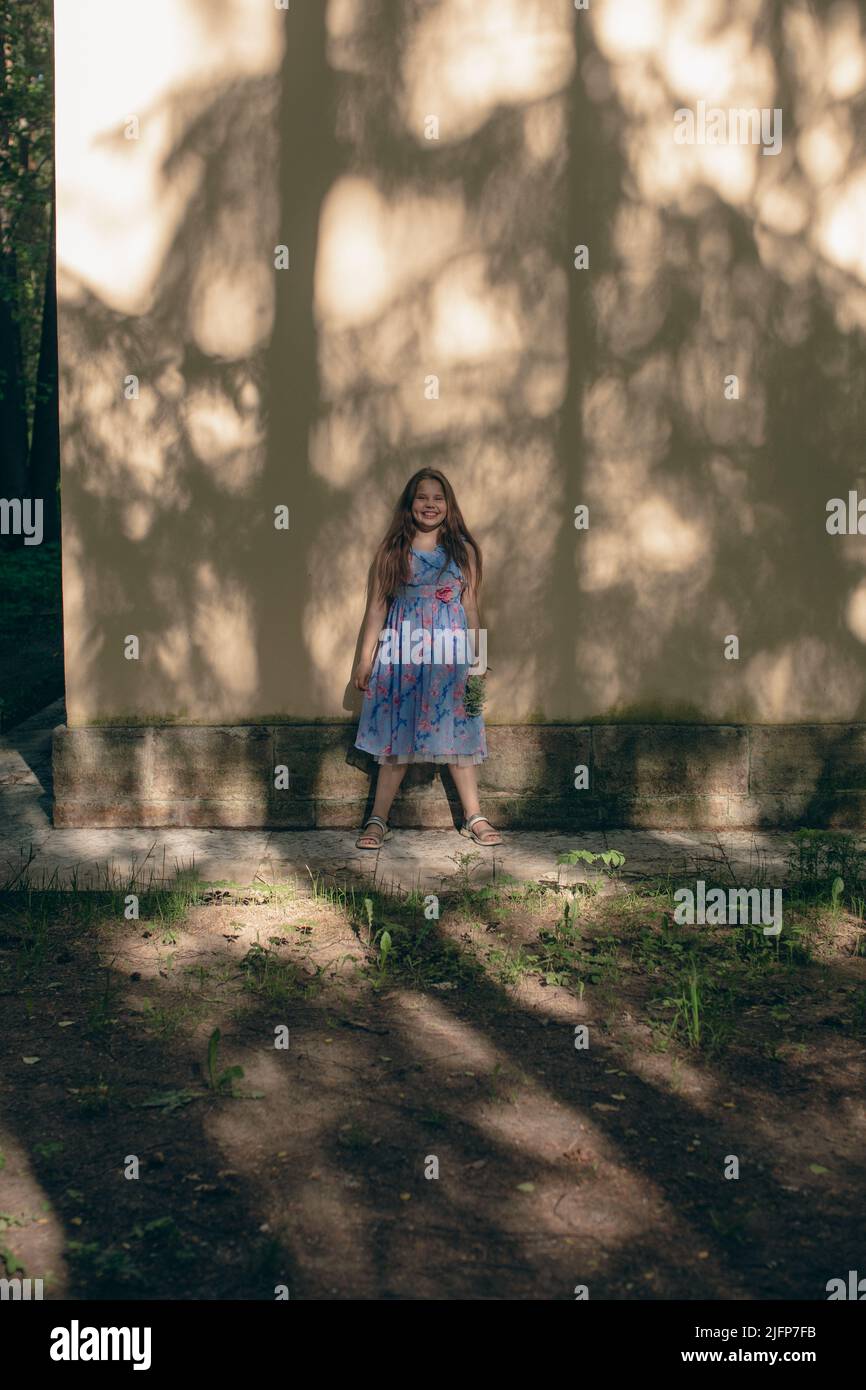 Shadow girl on an orange wall in summer Stock Photo - Alamy