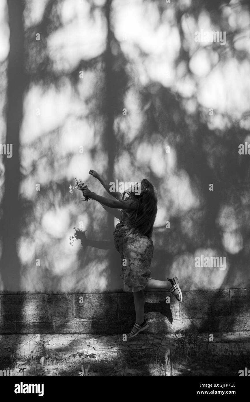 Shadow girl on an orange wall in summer Stock Photo - Alamy