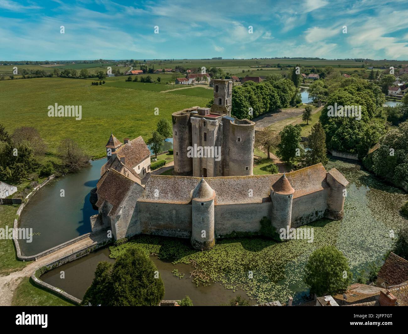 Aerial view of Sagonne castle in France with inner complex surrounded ...