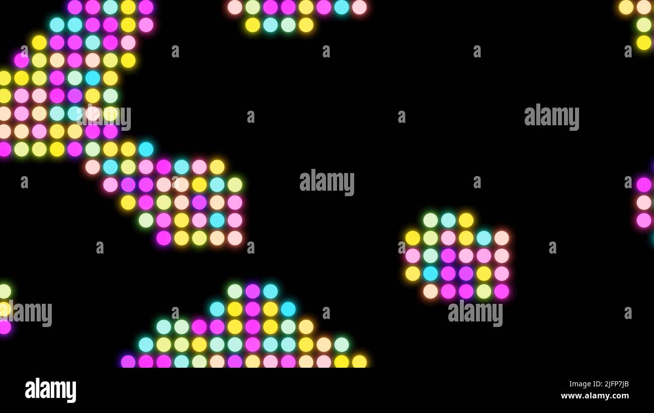 Colorful dots moving in spots on black background. Design. Moving spots ...