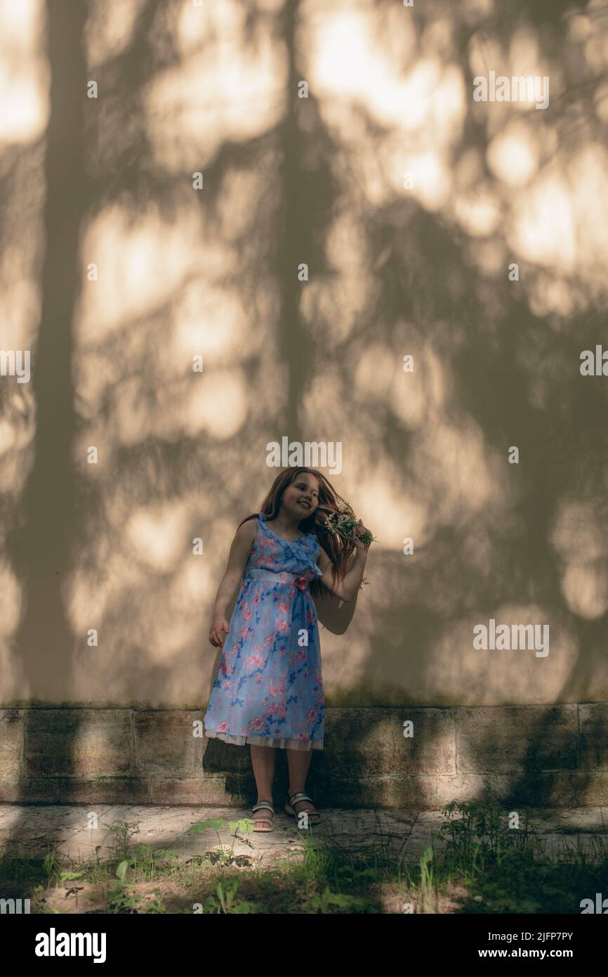 Shadow girl on an orange wall in summer Stock Photo - Alamy