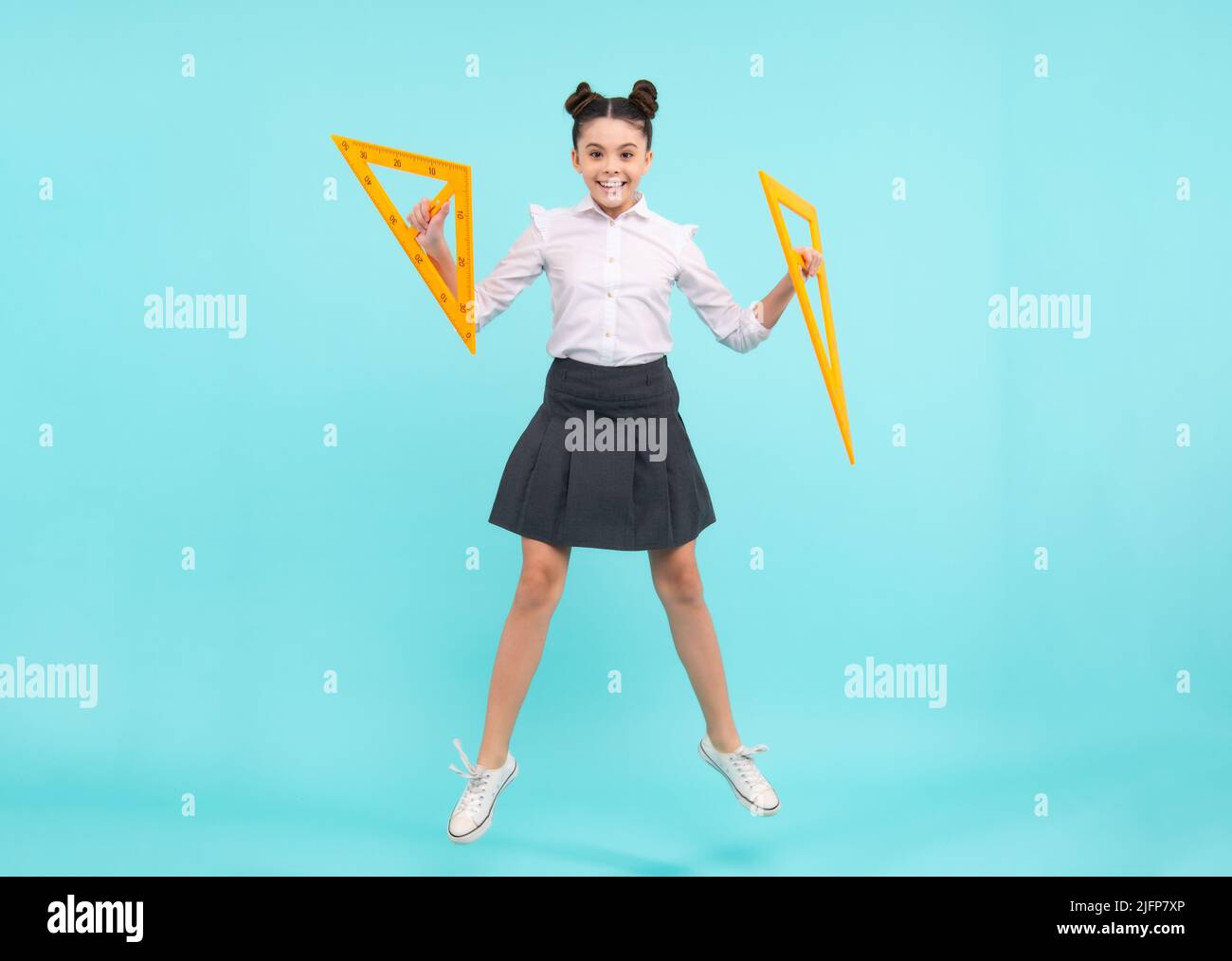 Teenager child school girl holding measure for geometry lesson ...