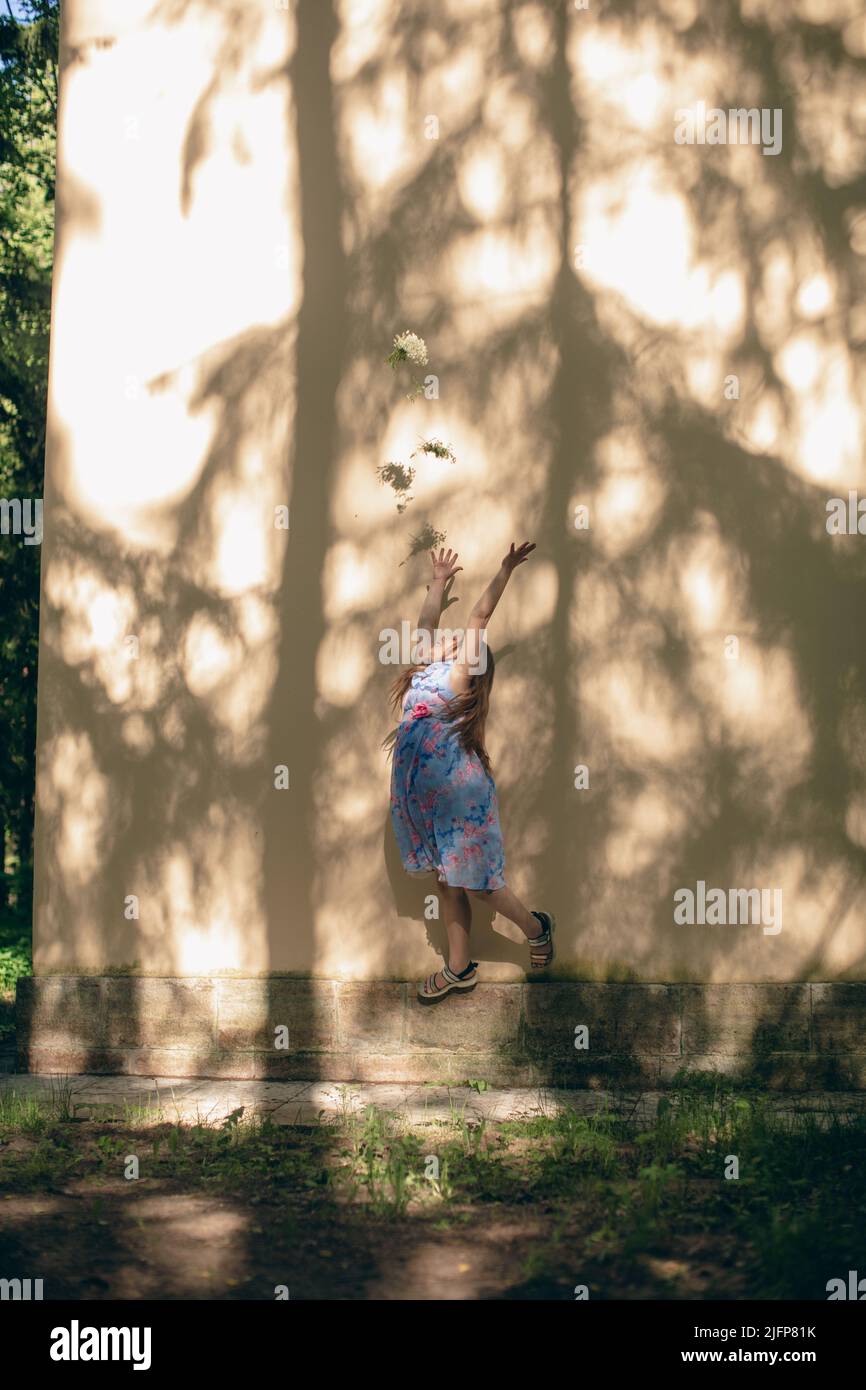 Shadow girl on an orange wall in summer Stock Photo - Alamy
