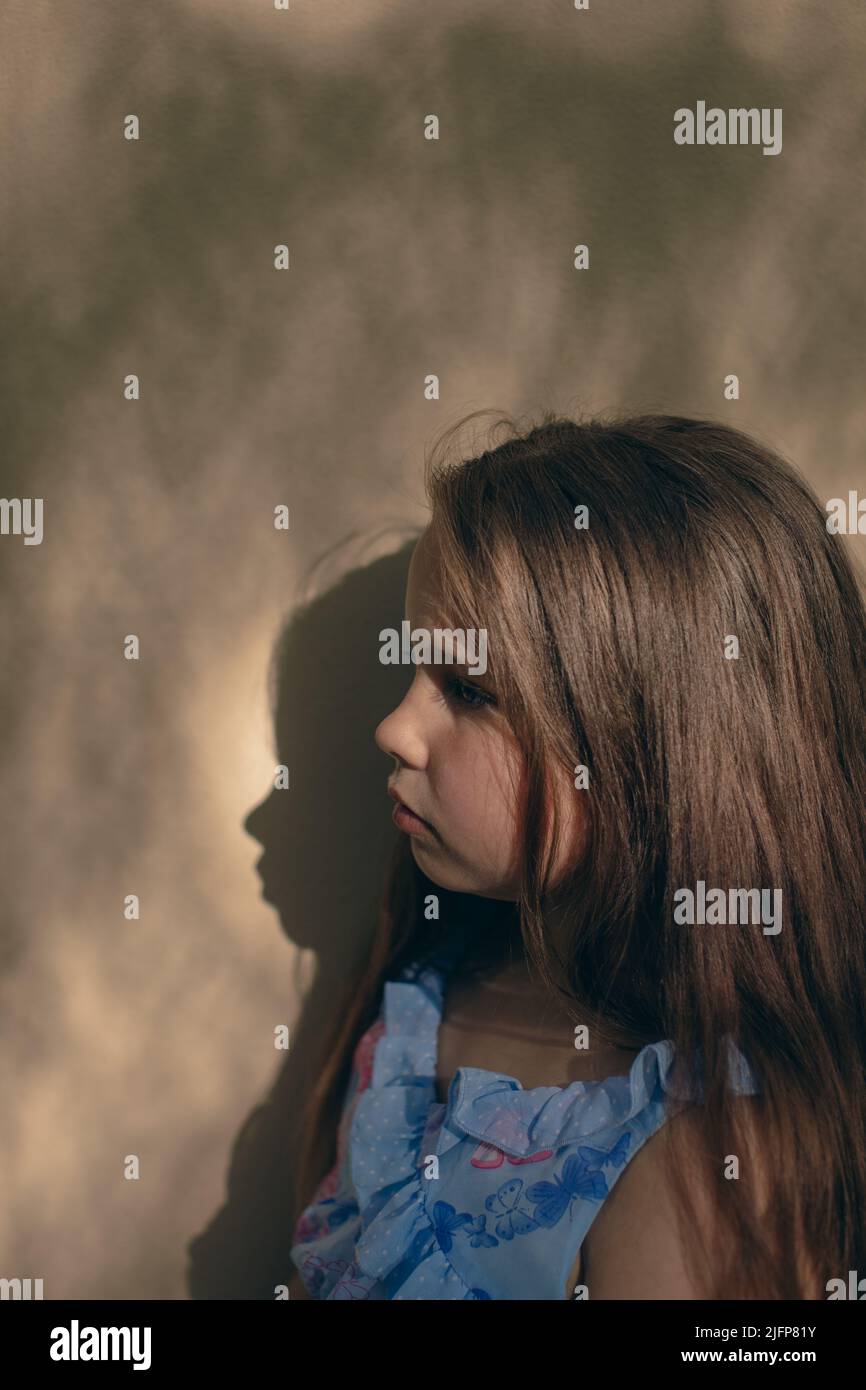 Shadow girl on an orange wall in summer Stock Photo - Alamy
