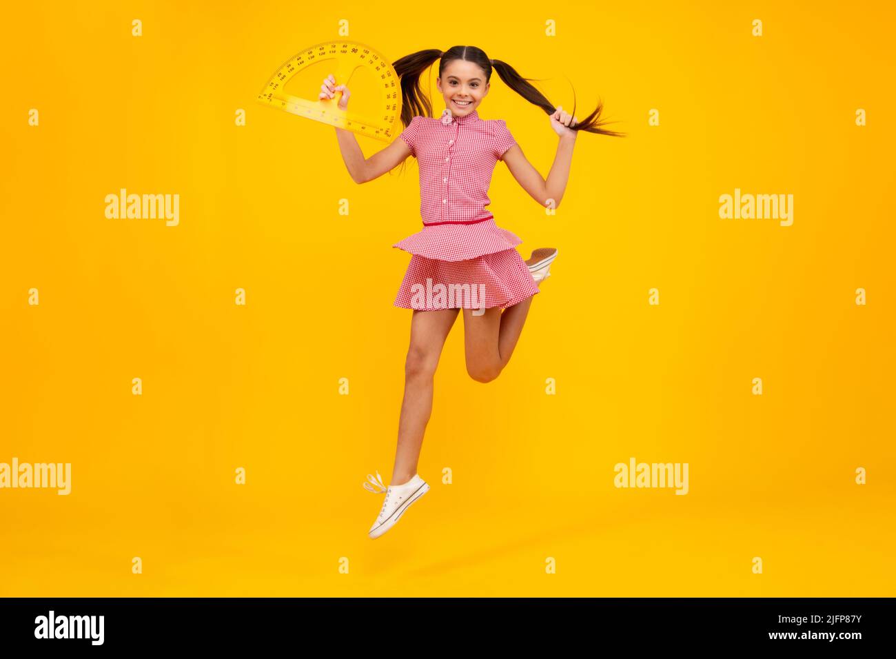 Teenager school girl study math or geometry lesson, measure the size ...