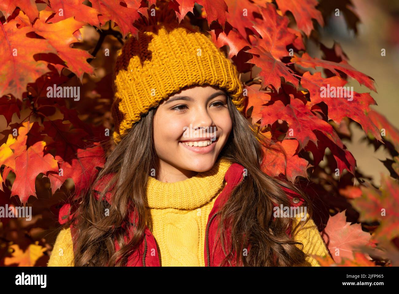 Autumn teen child girl portrait, fall leaves concept. glad child in hat ...