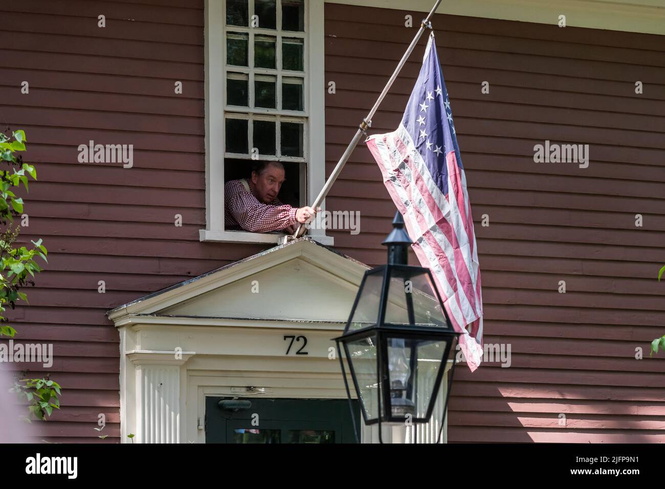 Putting up the Betsy Ross flag Stock Photo - Alamy