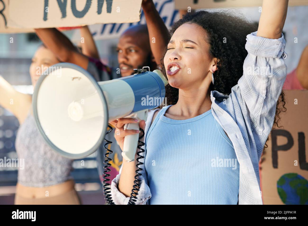 Taking a stand. Cropped shot of a group of young people protesting in ...