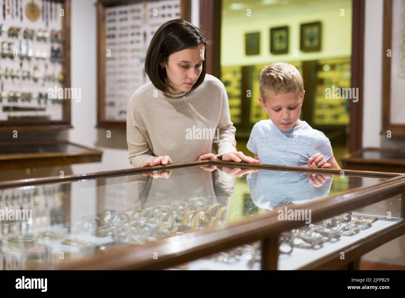 Woman and boy exploring artworks in museum Stock Photo - Alamy