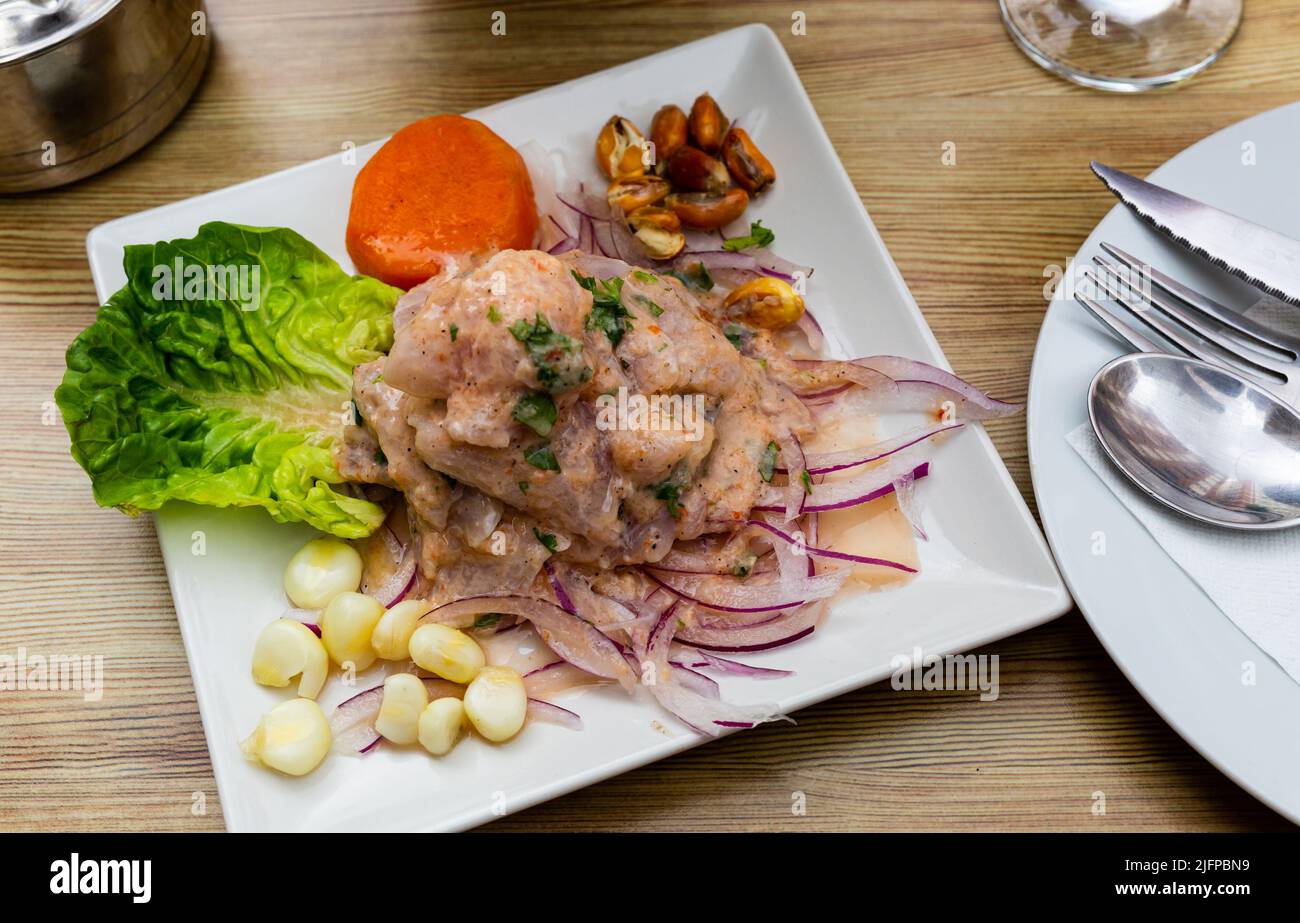 Seafood ceviche from hake with onion and vegetables Stock Photo - Alamy