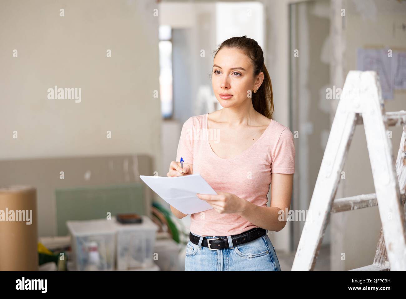 Woman architect checking building plan hi-res stock photography and ...