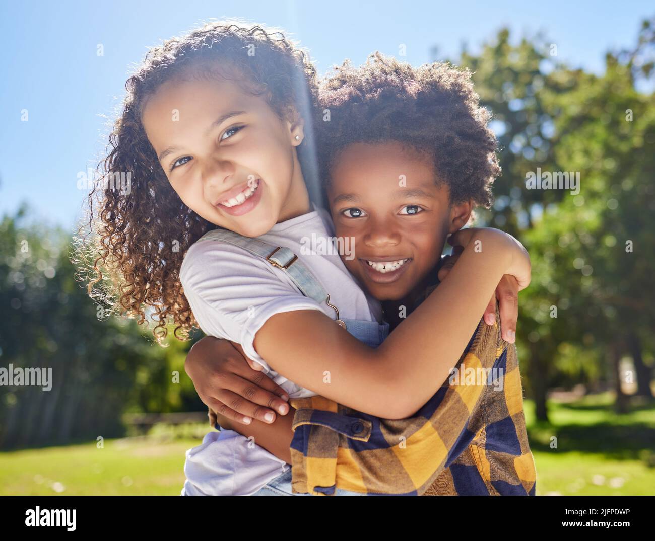 Boy hugging a girl hi-res stock photography and images - Alamy