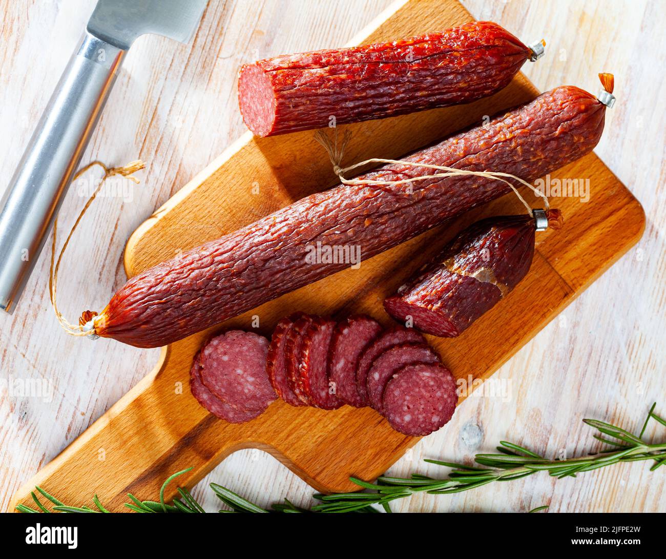 Russian dry smoked sausage with rosemary Stock Photo - Alamy