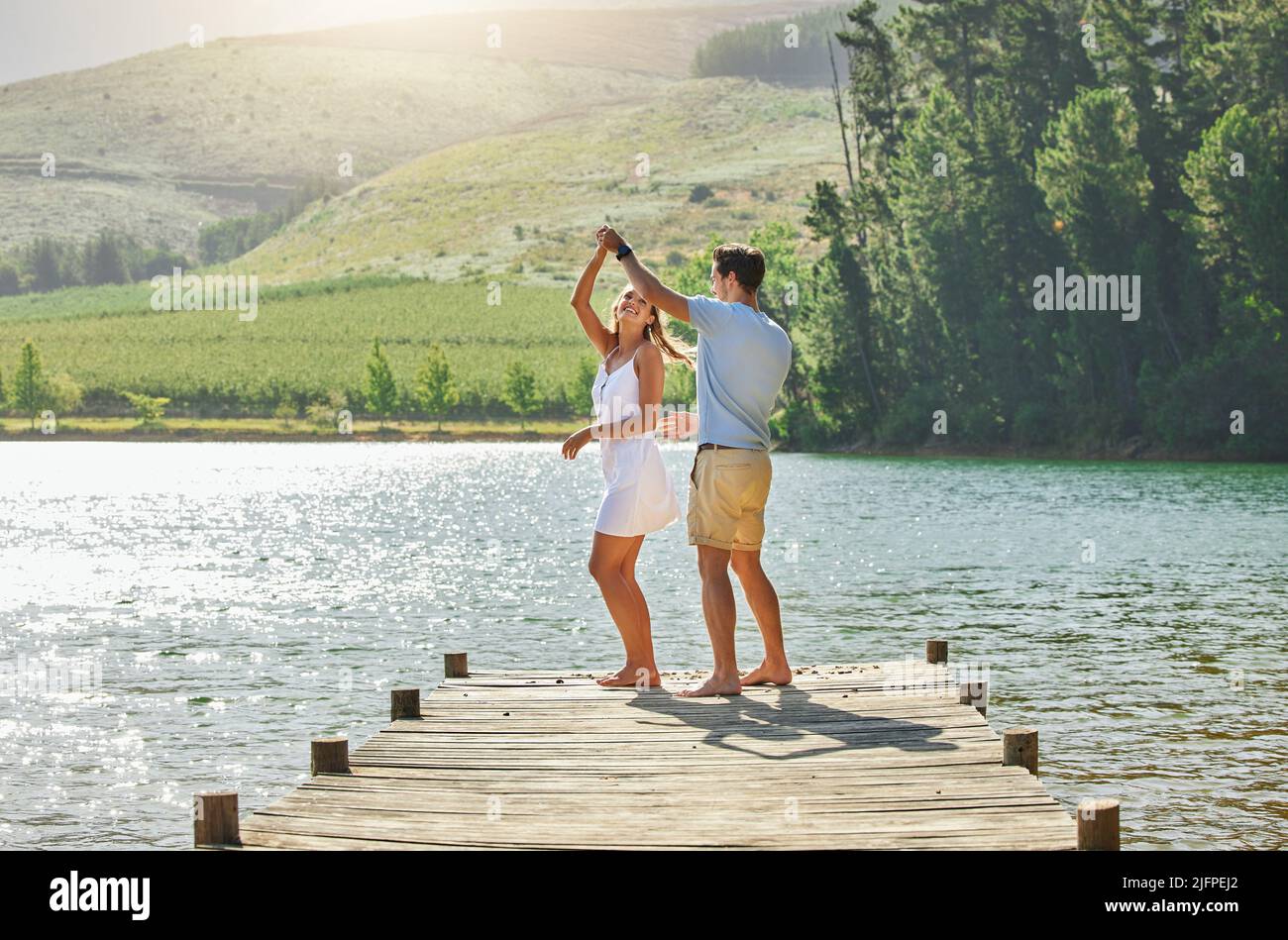 My heart beats for you. Shot of a young couple bonding while standing ...